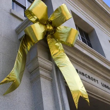 Giant Building Bows - Golden Openings